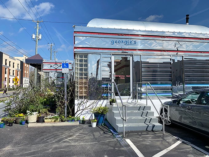 The gleaming stainless steel exterior of Georgie's Diner stands like a time machine to the golden age of roadside dining. Pure Americana awaits inside!