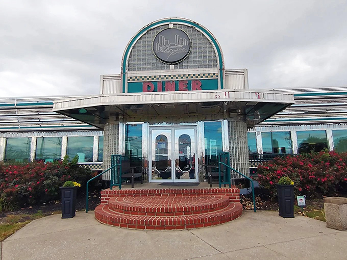 The classic curved facade with its bold "DINER" signage isn't just an entrance&mdash;it's a time machine to when comfort food reigned supreme.