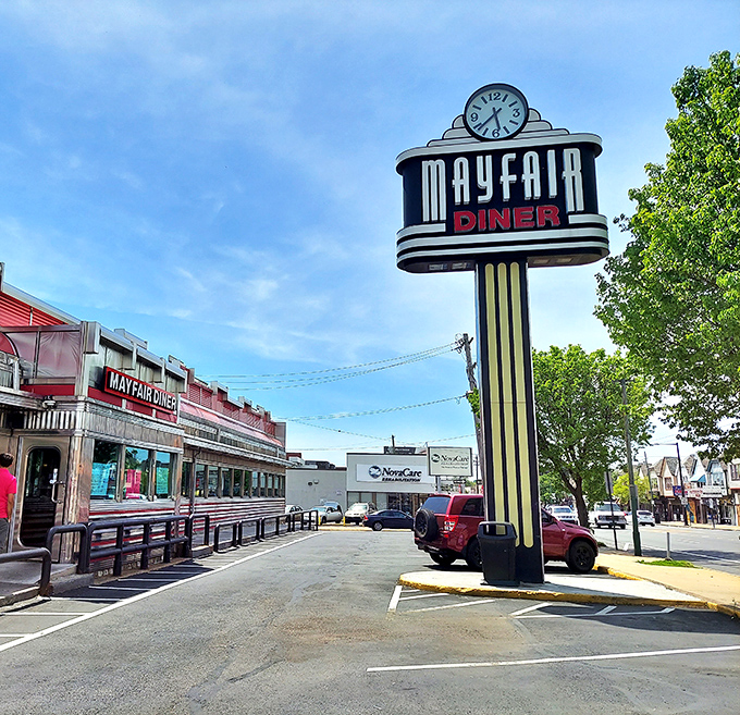 The iconic Mayfair Diner sign stands tall against the Philadelphia sky, a beacon of comfort food that's been calling hungry patrons home for generations.