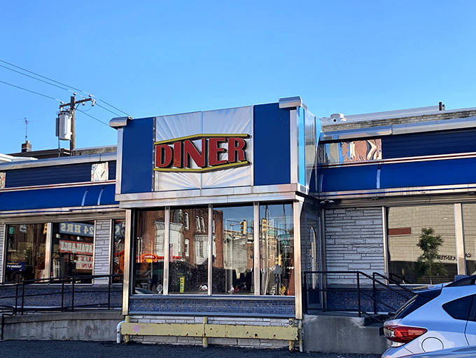 The iconic blue exterior of Broad Street Diner stands as a beacon of breakfast hope on Philadelphia's bustling thoroughfare, promising comfort food and nostalgia in equal measure.
