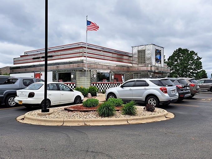 Chrome-trimmed and proud, Gus's Diner stands like a time capsule with its American flag waving a welcome to hungry travelers in Sun Prairie.