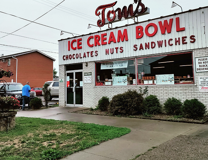 The iconic red sign of Tom's Ice Cream Bowl has been beckoning sweet-toothed pilgrims to Zanesville since 1948. Time stands deliciously still here.