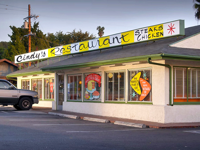 The iconic yellow and green sign of Cindy's Restaurant stands as a beacon of breakfast hope in Eagle Rock, promising steaks, chicken, and retro charm.