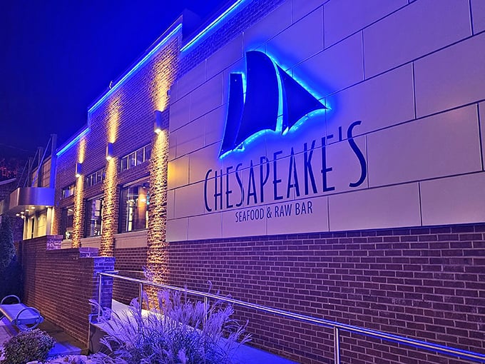 The glowing blue sailboat logo beckons seafood lovers like a lighthouse, promising an ocean of flavor in the heart of mountain country.