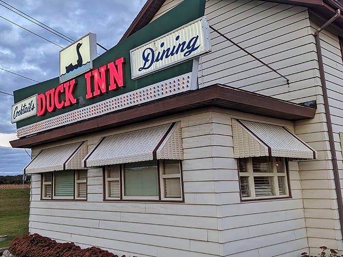The iconic green awning beckons like an old friend, promising comfort and indulgence just beyond those doors. Wisconsin supper club perfection awaits.