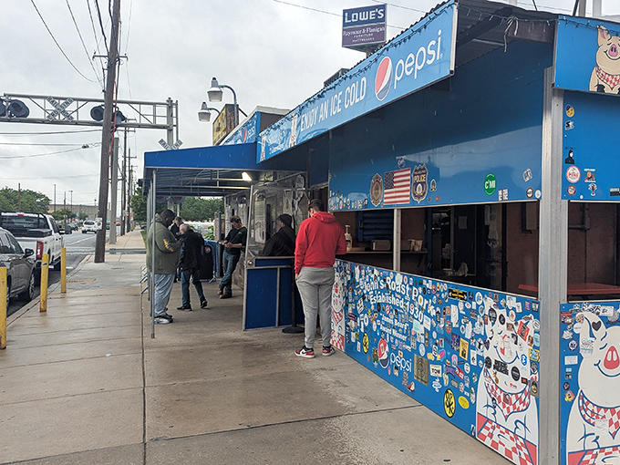 The blue exterior of John's Roast Pork stands out like a culinary lighthouse in South Philly, beckoning hungry pilgrims with its no-nonsense charm.