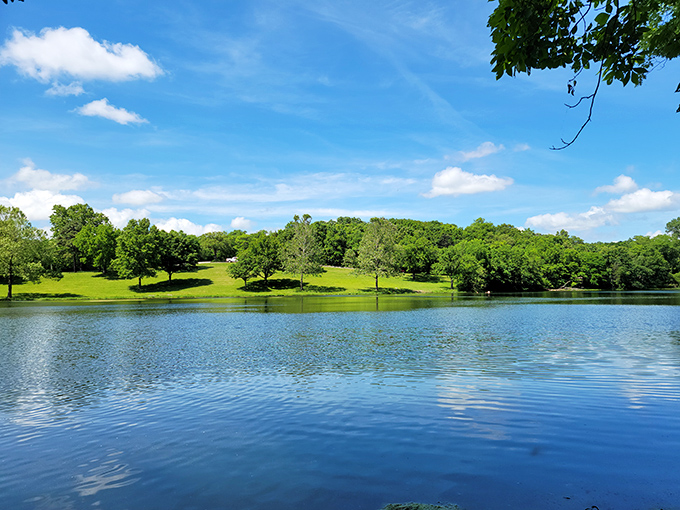 Mirror-like waters reflect a tapestry of green hills&mdash;nature's version of a selfie that never needs a filter.