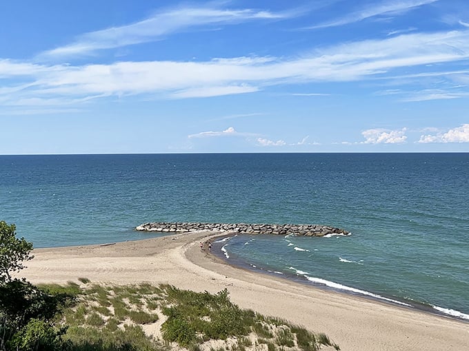 Sandy shores stretch endlessly where Lake Erie meets Pennsylvania's hidden coastal paradise.