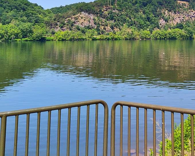 Where two mighty rivers meet, creating nature's perfect confluence. The historic railroad bridge stands as a silent sentinel to countless sunsets and fishing tales.