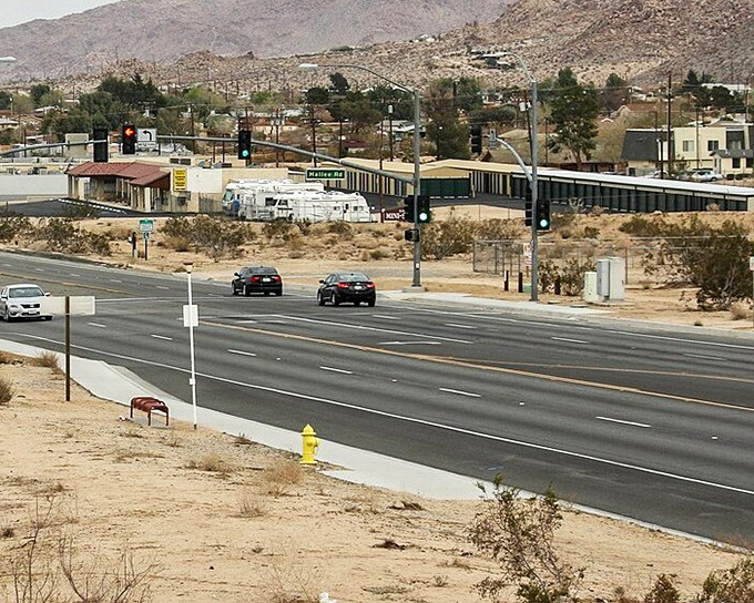 The main drag of Joshua Tree welcomes you with wide-open roads and that quintessential desert town vibe. No traffic jams here&mdash;just endless possibilities.
