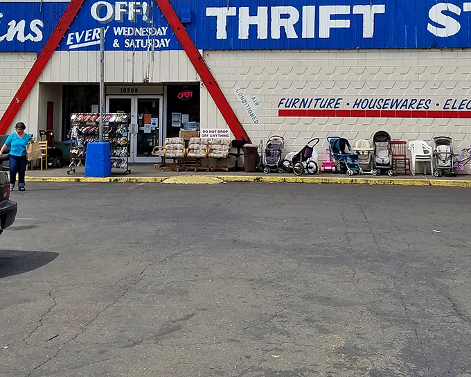 The blue and red exterior of Better Bargains stands like a retail mullet—business in the front, bargain party all around. Baby strollers await their next adventure.