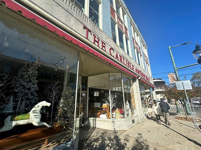 The iconic red awning of Carlisle Antique Mall beckons treasure hunters like a vintage siren song, promising discoveries that IKEA simply can't replicate.