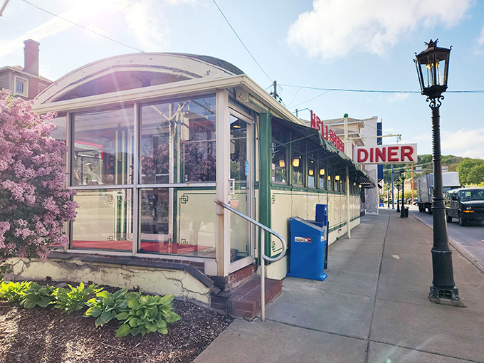 The gleaming vintage dining car of Wellsboro Diner stands proudly on Main Street, its classic "DINER" sign promising comfort food and nostalgia in equal measure.