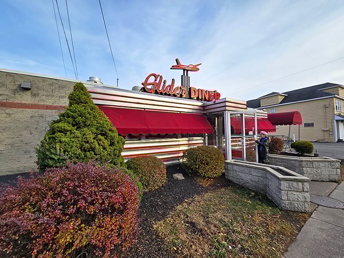 The iconic red glider plane perched atop this classic Scranton diner isn't just decoration—it's a beacon calling hungry travelers home to comfort food paradise.
