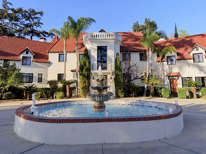Mediterranean dreams come to life at Wrensmoor Castle, where terracotta roofs and a circular fountain create the perfect California-meets-Spain fantasy.