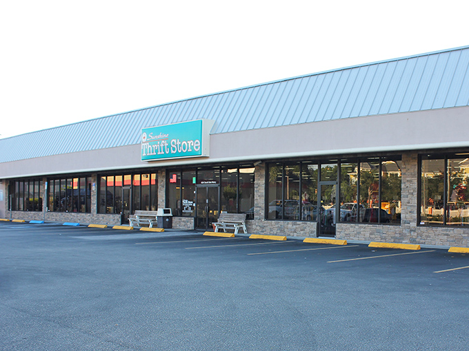 The distinctive teal sign of Sunshine Thrift welcomes bargain hunters like a retail oasis in the Florida heat, promising treasures within its unassuming exterior.