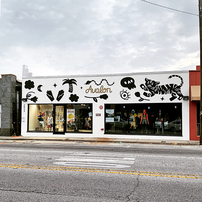 The whimsical storefront of Avalon Exchange beckons with playful murals and the promise of fashion treasures waiting to be discovered inside. 