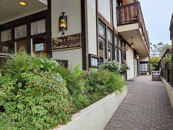 The charming exterior of Katy's Place welcomes you with colorful flower boxes and rustic wooden doors &ndash; Carmel's breakfast paradise hiding in plain sight.
