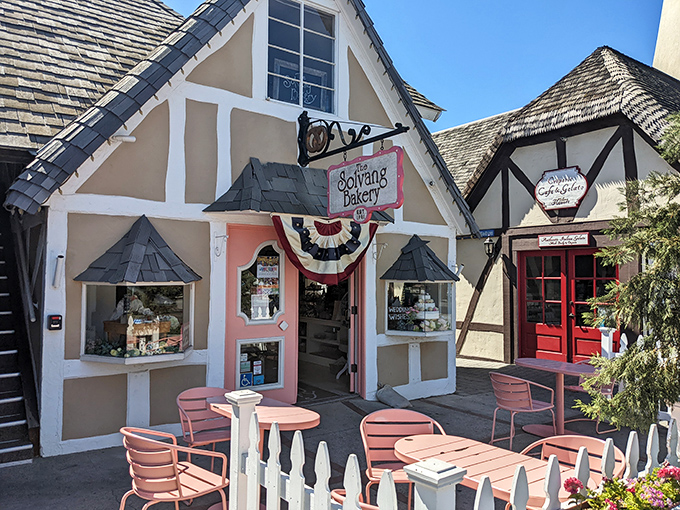The storybook charm of Solvang Bakery's exterior makes you wonder if calories consumed in fairytale buildings actually count. Those pink tables are calling your name.