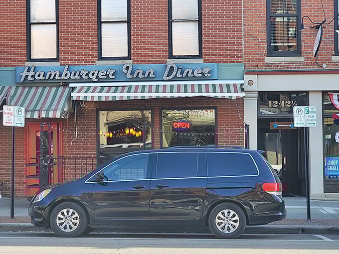 The unassuming storefront of Hamburger Inn Diner beckons with its vintage charm and green-striped awning &ndash; a time portal to simpler, more delicious days.