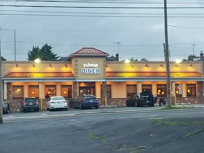 The Folcroft Diner glows like a beacon of comfort food hope at dusk, its warm lights promising delicious refuge from the daily grind.