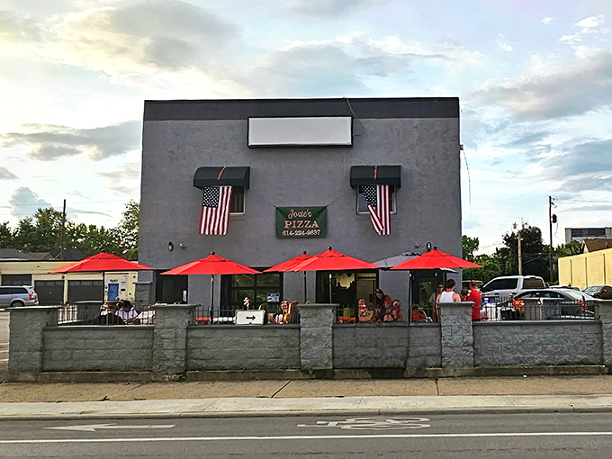 The gray fortress of flavor on West Broad Street stands proud with American flags and those inviting red umbrellas beckoning pizza pilgrims inside.