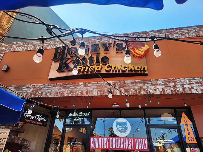 The golden glow of Honey's Kettle beckons from Culver City's streets, promising fried chicken nirvana under those charming string lights.