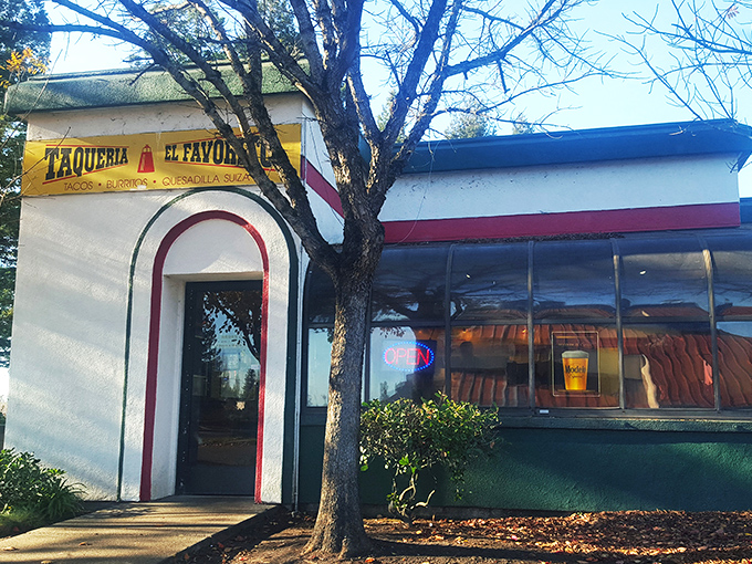 The unassuming exterior of Taqueria El Favorito proudly wears Mexico's colors like a badge of honor. This little building holds big flavors inside.