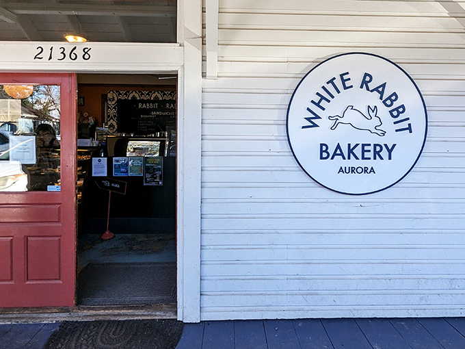 The unassuming exterior of White Rabbit Bakery, with its coral-colored doors, proves once again that the best culinary treasures often hide in plain sight.