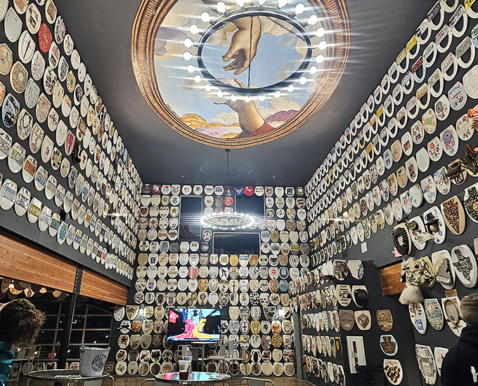 Wall-to-wall wonder! The interior of Barney Smith's Toilet Seat Art Museum showcases hundreds of decorated seats, creating an unexpectedly mesmerizing visual experience.