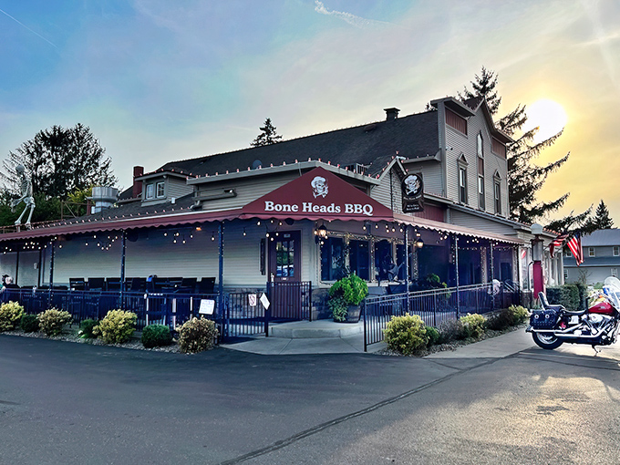The sun sets behind Bone Heads BBQ like nature's own spotlight, highlighting this unassuming treasure that's been turning Willis, Michigan into a barbecue destination.