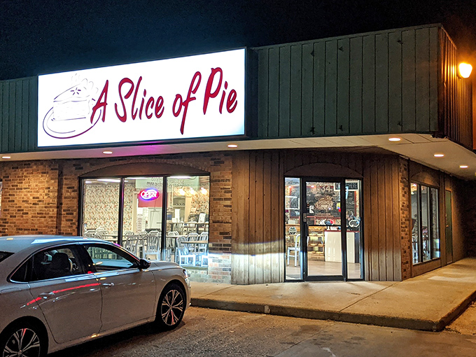 The green exterior and bold red signage stand as a humble beacon of hope for weary travelers. This unassuming storefront holds treasures that would make Marie Antoinette rethink her cake recommendation.