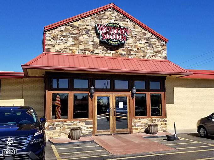 Stone facade meets red metal roofing in this unassuming temple to Southern comfort food excellence.