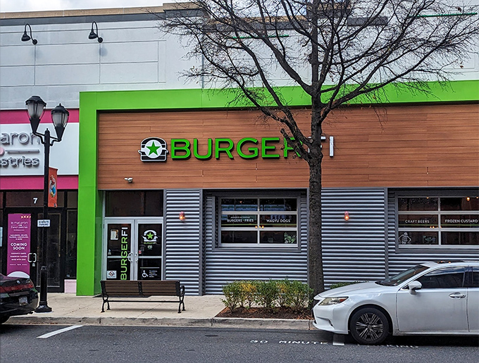 BurgerFi's vibrant green facade stands out like a beacon of burger hope in Gaithersburg. The modern wood paneling says "we're not your average fast food joint."