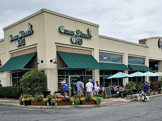 Green awnings and flower boxes create the perfect "come on in" vibe that makes strangers feel like regulars.