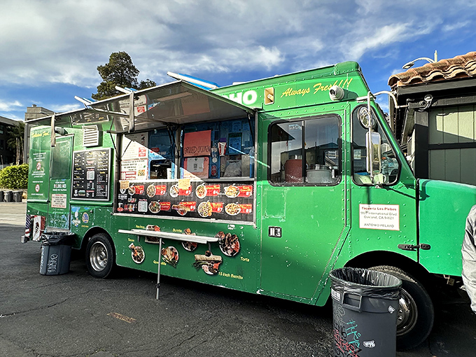 That emerald green food truck isn't just transportation &ndash; it's a mobile temple of authentic Mexican flavors. 