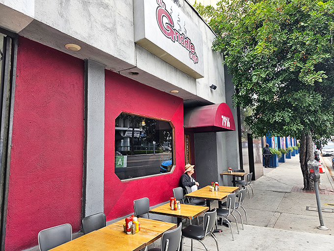 That unassuming red storefront holds breakfast secrets that would make your grandmother weep with joy.