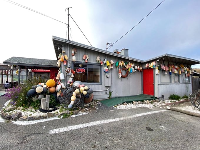 The quintessential coastal shack fantasy come to life&mdash;colorful buoys dangling like maritime Christmas ornaments against weathered wood that's seen a thousand foggy mornings.