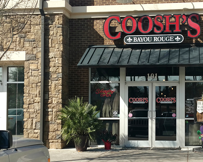 The bright red "COOSH'S" sign beckons like a culinary lighthouse. This unassuming storefront houses biscuit magic that locals line up for religiously.