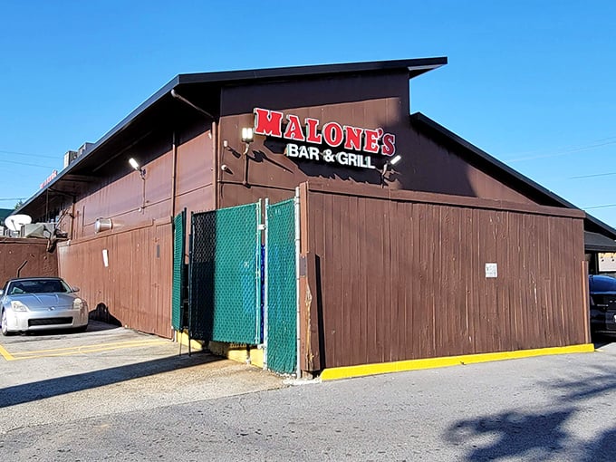 The unassuming exterior of Malone's Bar & Grill proves once again that the best seafood often hides behind the most modest facades.
