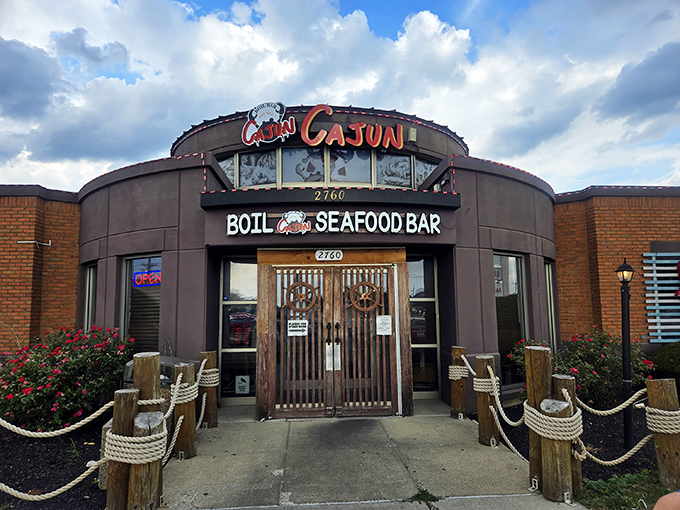 The circular fortress of flavor announces itself boldly on Taylor Road, where those wooden posts and nautical ropes aren't just decoration&mdash;they're foreshadowing the hands-on adventure waiting inside.