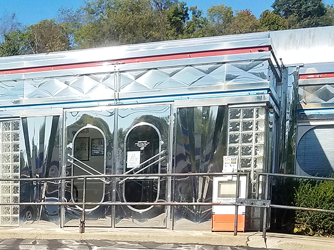 The gleaming stainless steel exterior of Maddy's Diner 23 shines like a beacon of hope for hungry travelers. Classic Americana at its finest.