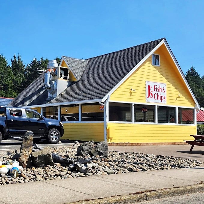 The bright yellow beacon of J's Fish & Chips stands out against the Oregon sky, promising seafood salvation to hungry coastal travelers.