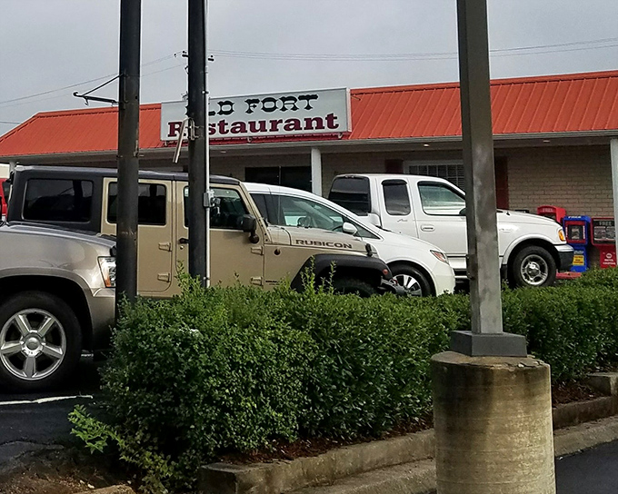 The unassuming exterior of Old Fort Restaurant glows like a beacon for hungry travelers. No fancy frills, just the promise of honest-to-goodness Southern cooking inside.