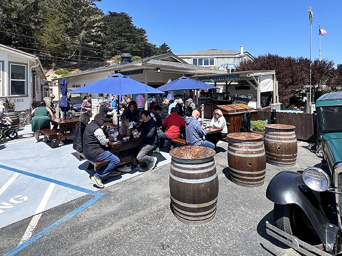 The coastal beacon of seafood salvation! Spud Point Crab Company's cheerful blue sign welcomes hungry pilgrims to this unassuming temple of maritime delights.