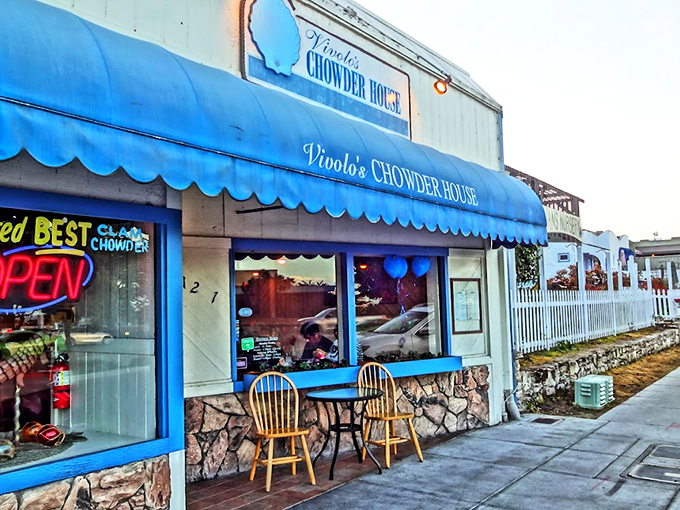 The iconic blue awning of Vivolo's stands out like a maritime flag, beckoning hungry travelers with the promise of chowder perfection.