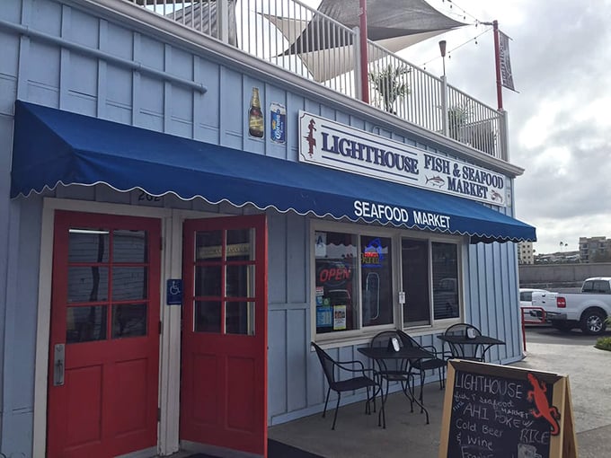The iconic blue awning beckons seafood lovers like a maritime siren song. This unassuming storefront houses treasures fresher than your excuses for not visiting sooner.