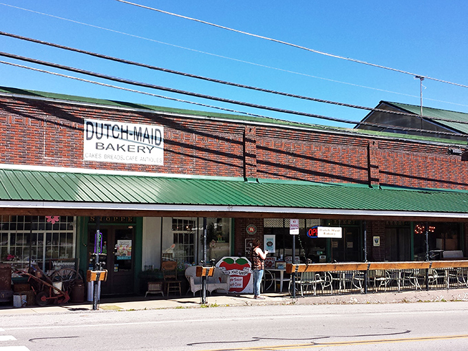The brick facade of Dutch Maid Bakery & Cafe stands proudly in Tracy City, its green awning like a welcome flag to hungry travelers seeking authentic Tennessee flavors. 