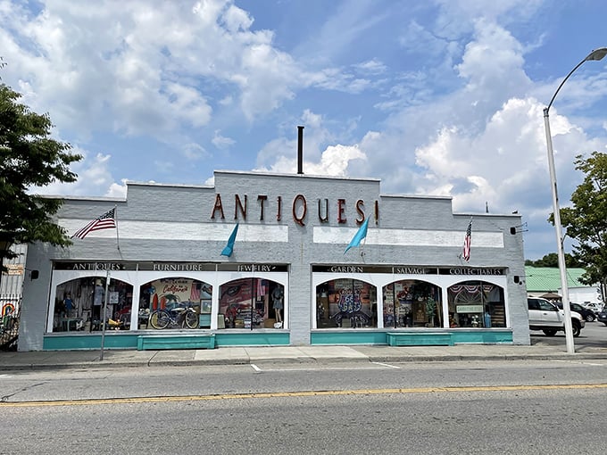 The iconic white facade of Charlotte's Web Antique Mall beckons with its bold "ANTIQUES!" declaration &ndash; like a siren song for treasure hunters everywhere.
