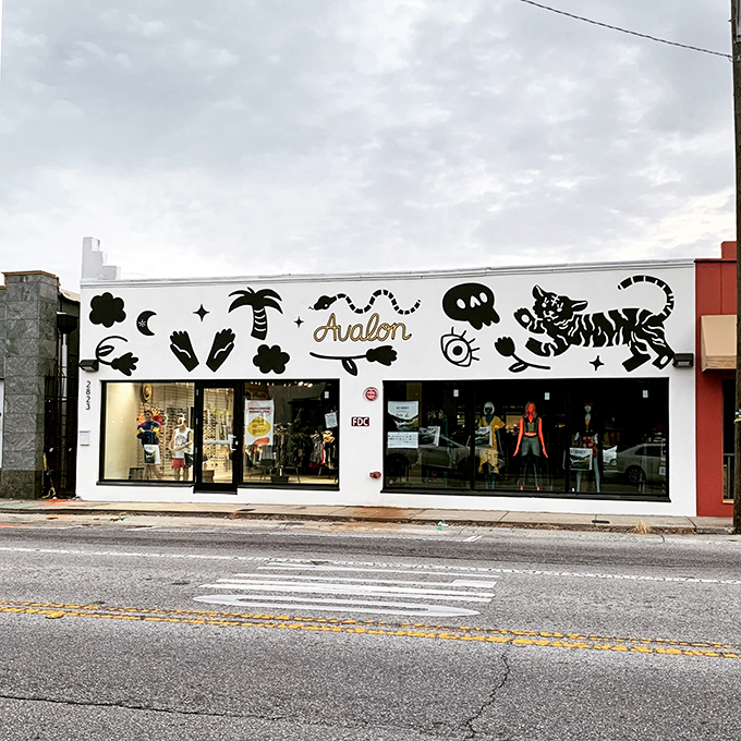 The whimsical storefront of Avalon Exchange beckons with playful murals and the promise of fashion treasures waiting to be discovered inside. 
